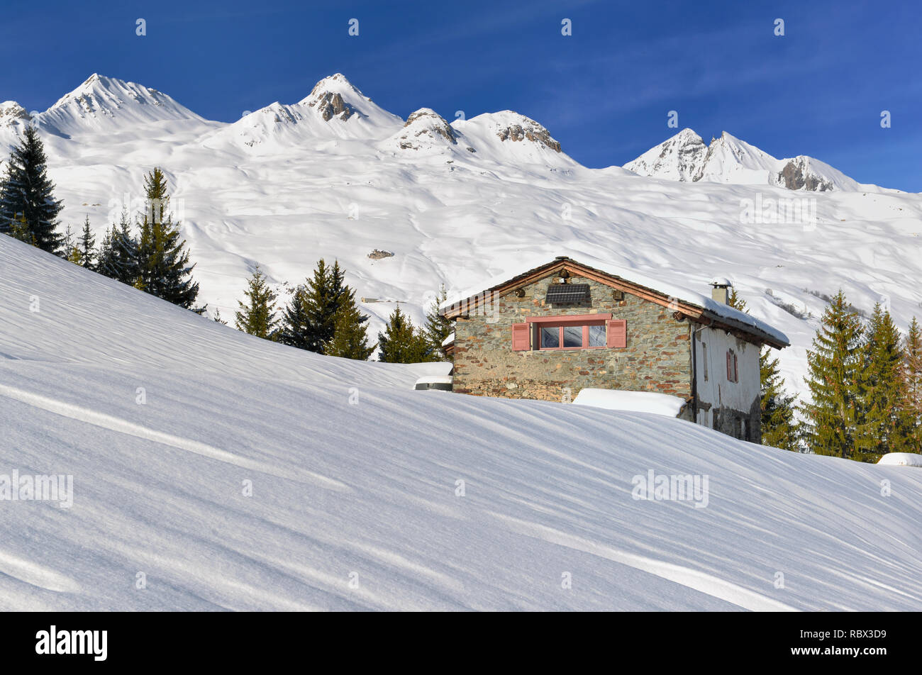 traditional alpine cottage in french alpine mountain under the snow ...