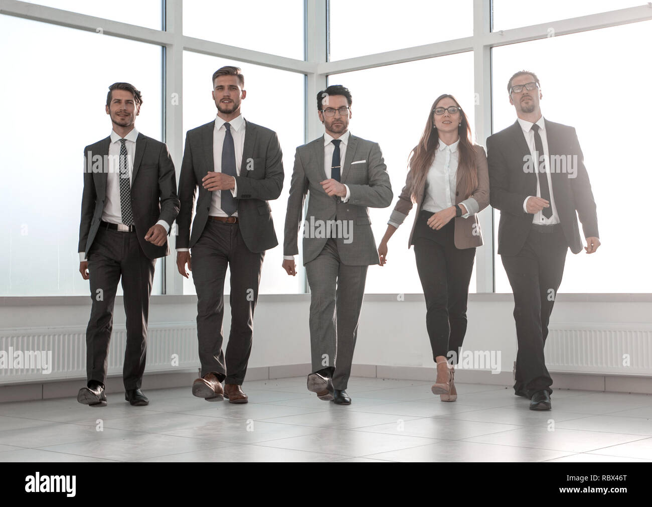 business team, walking at modern office interior Stock Photo - Alamy