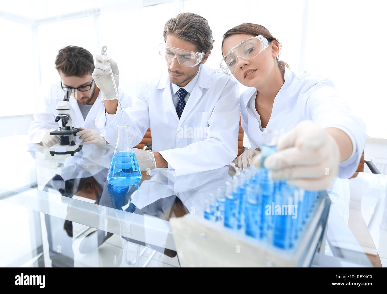 Sitting holding expertise science research laboratory hi-res stock ...