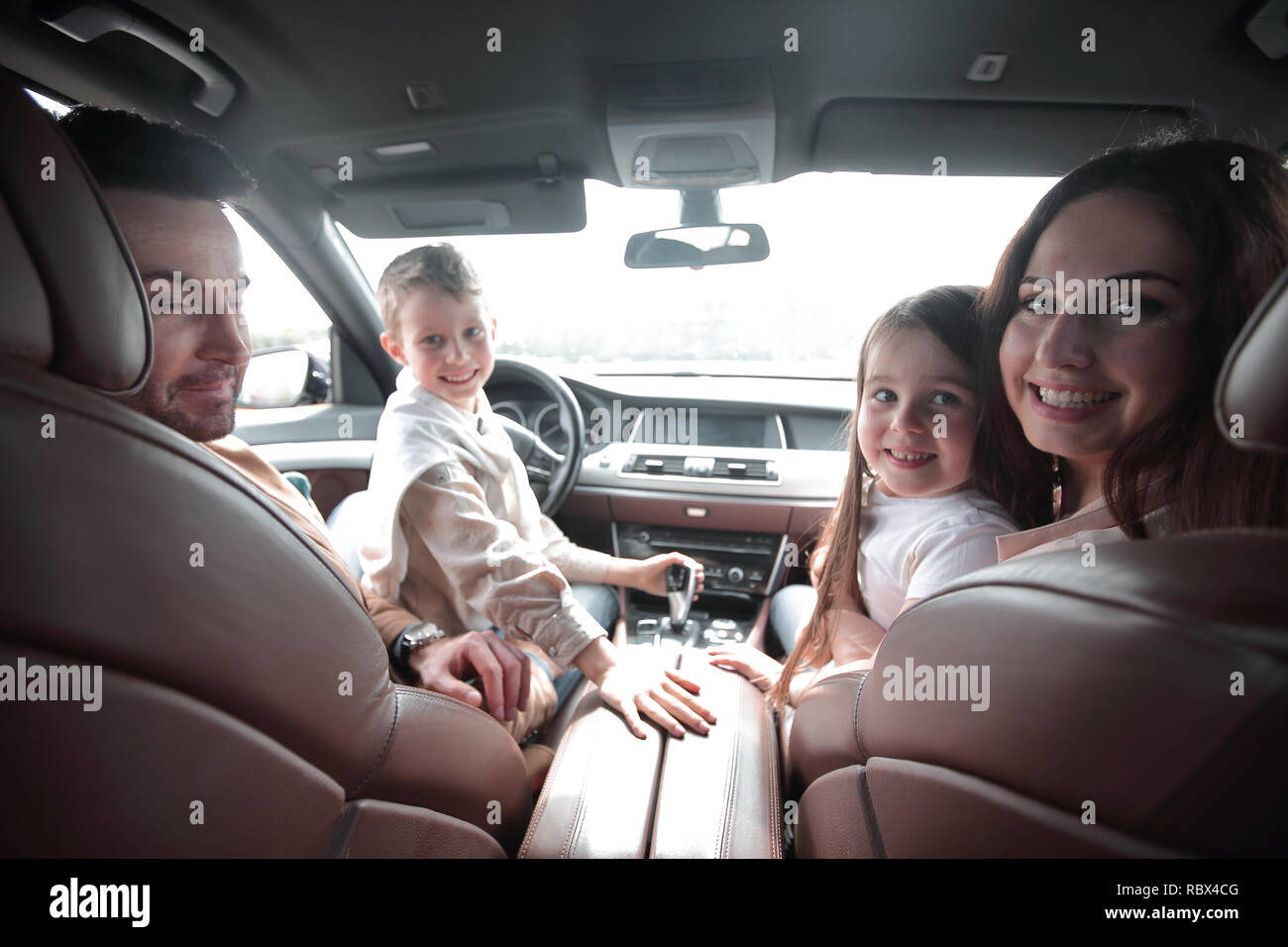 modern family sitting in a comfortable car Stock Photo - Alamy