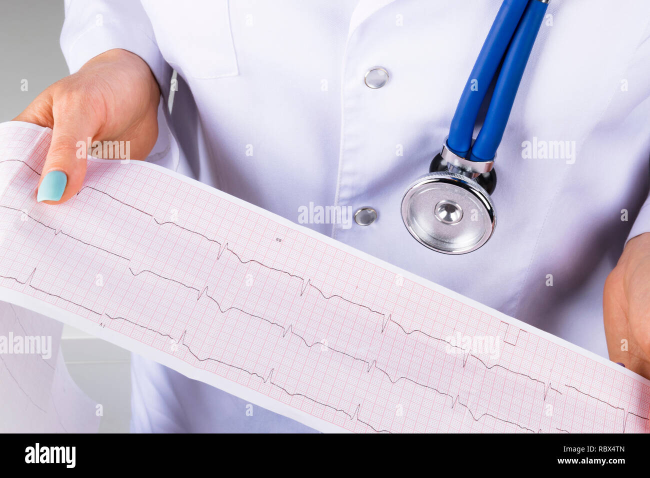 Electrocardiogram, ecg in hand of a female doctor. Medical health care ...