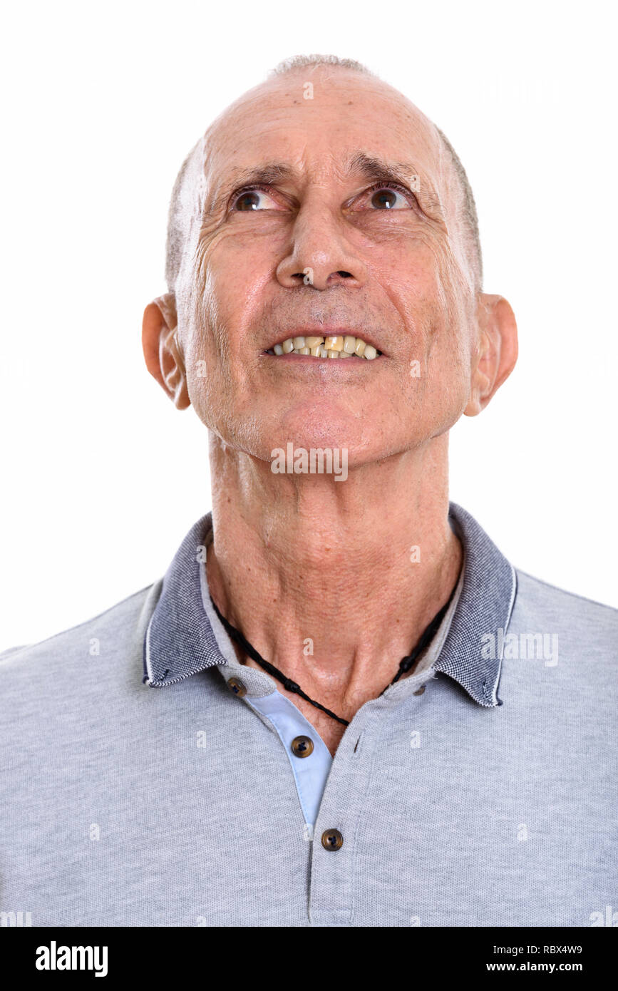 Face of happy senior man smiling while thinking Stock Photo - Alamy
