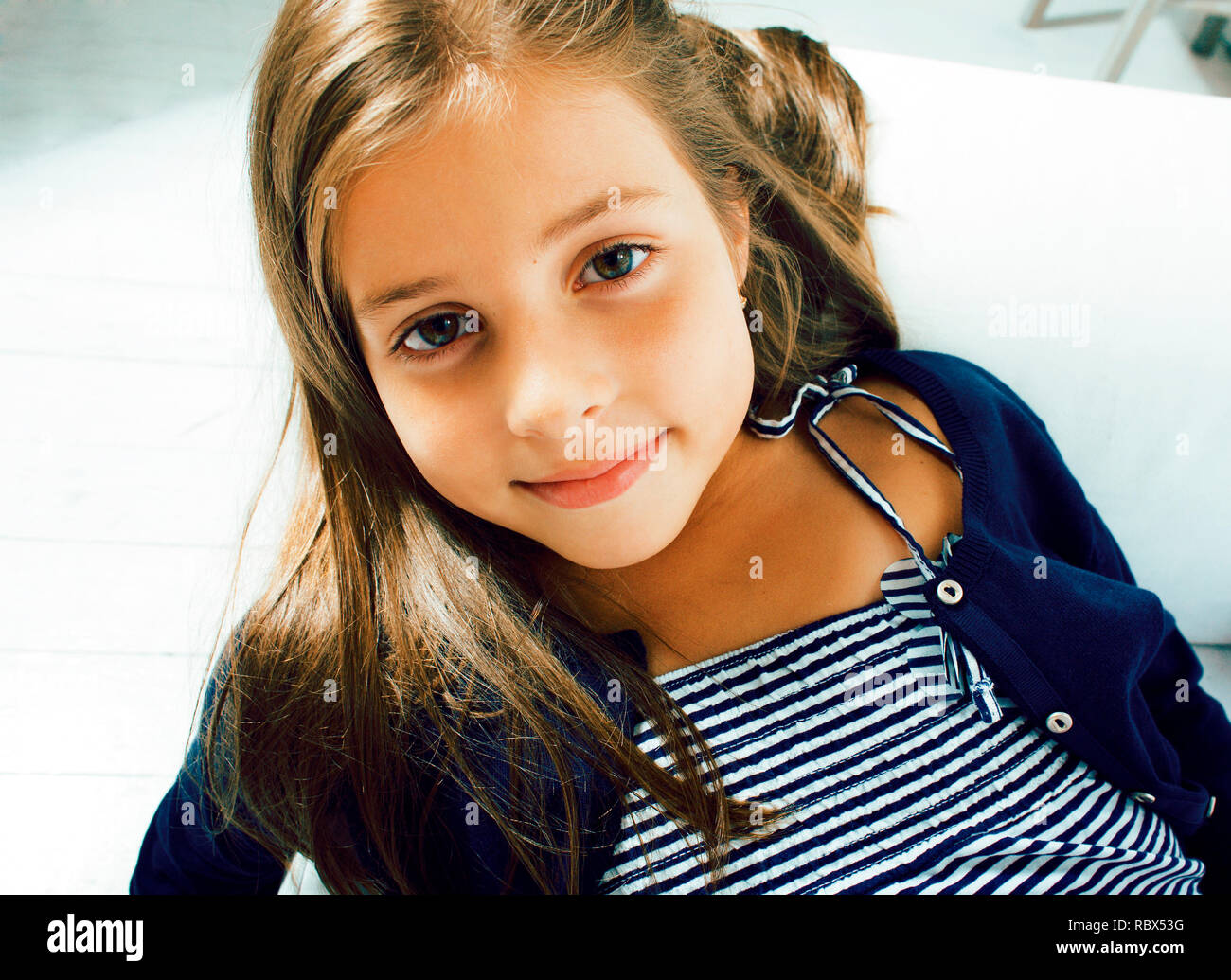 little cute brunette girl at home interior happy smiling close u Stock ...