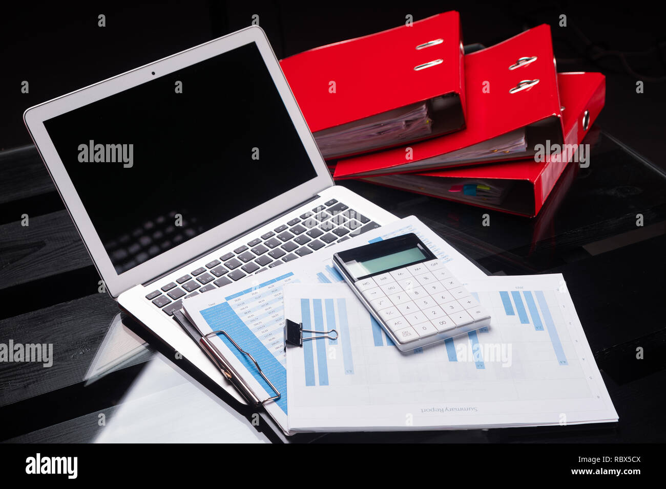 Office workplace with documents and stationery near red folders Stock Photo - Alamy