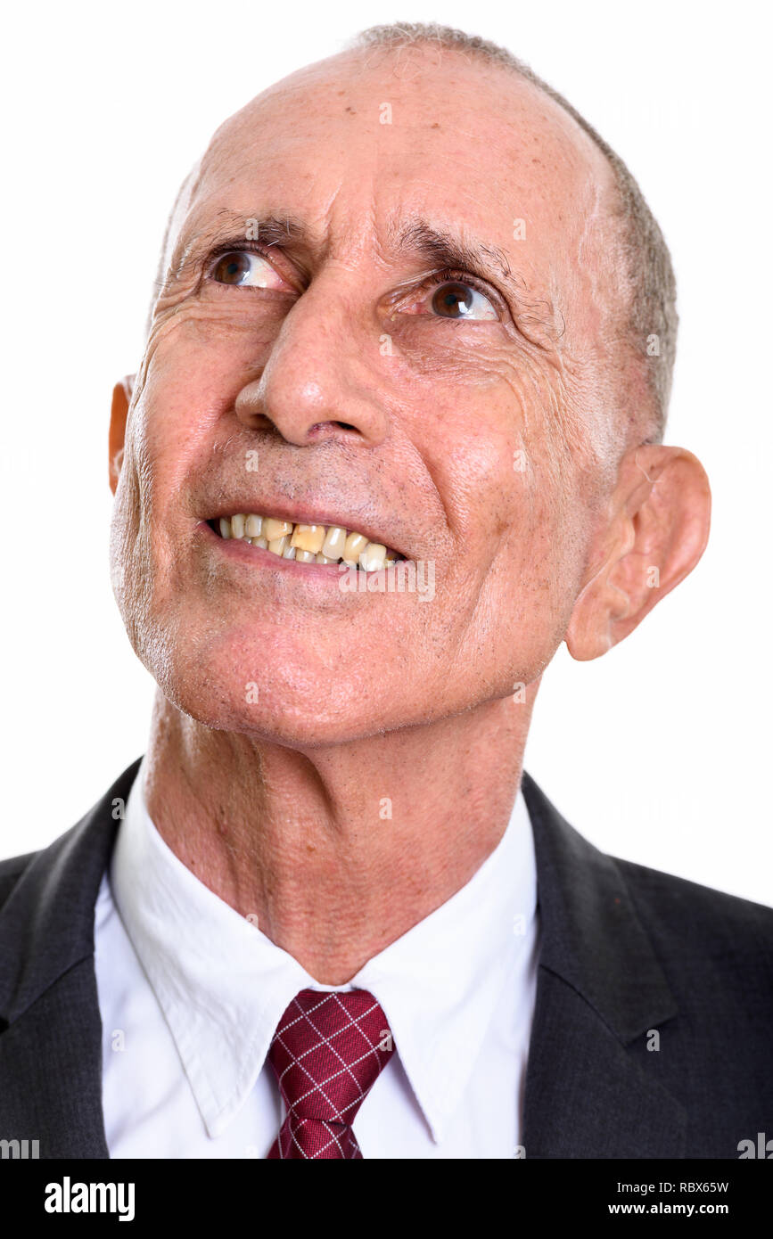 Face of happy senior businessman smiling while thinking Stock Photo - Alamy
