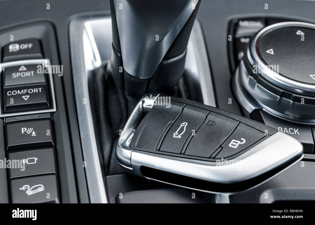 Closeup inside vehicle of wireless key ignition. Start engine key. Car ...