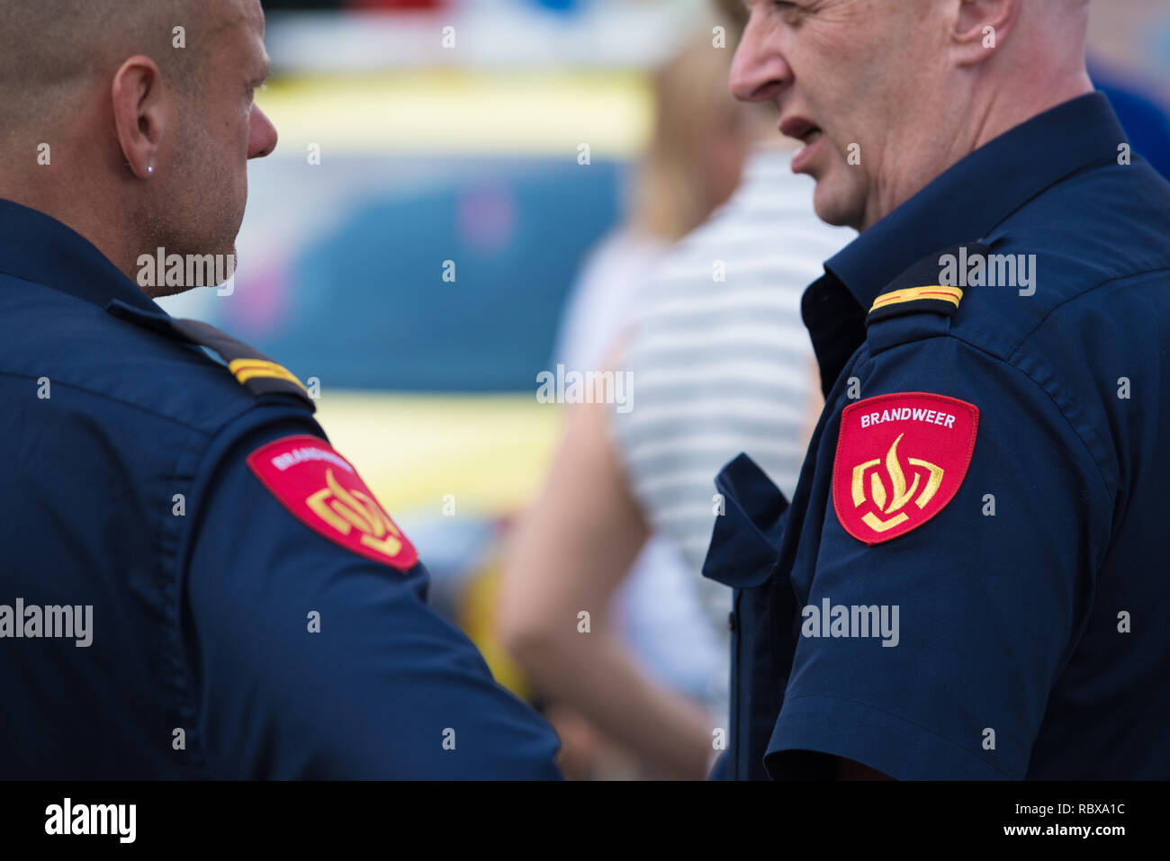 ROTTERDAM, NETHERLANDS - SEPTEMBER 3, 2017: Two firefighters talking ...