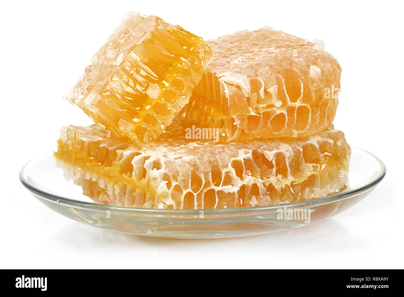 Honeycomb in glass dish isolated on white background Stock Photo - Alamy