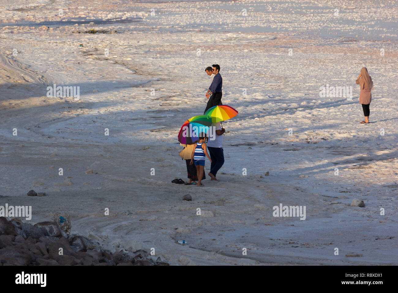 People are walking on the salt flat of Urmia Lake, West Azerbaijan ...