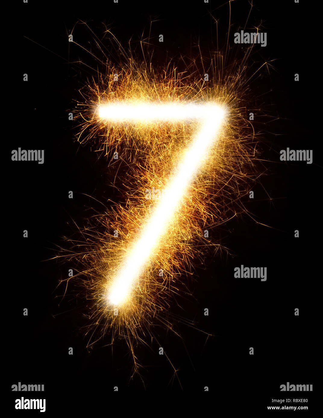Number 7 drawn with spaklers on a black background Stock Photo - Alamy