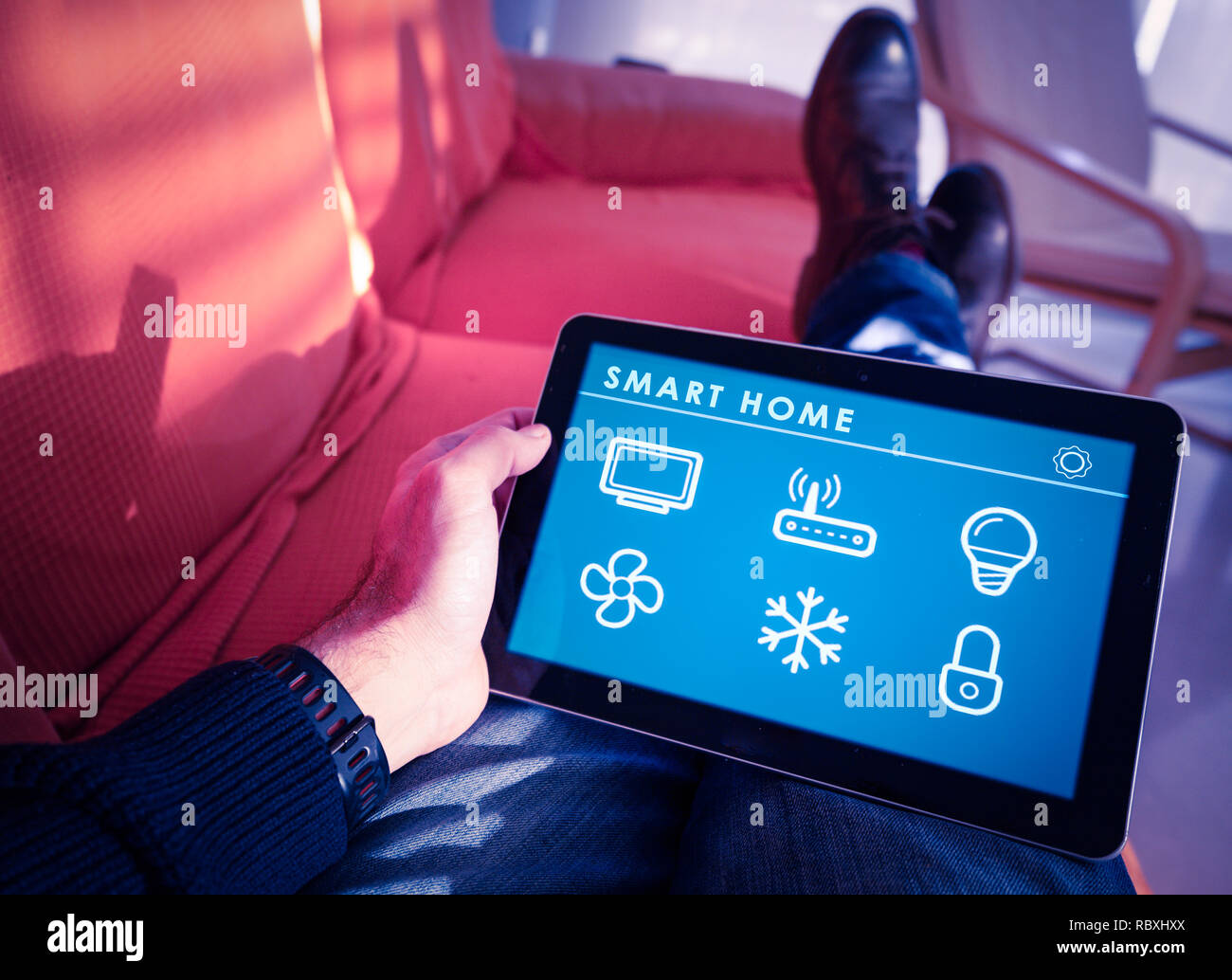 Smart home technology interface on tablet app screen, person holding ...