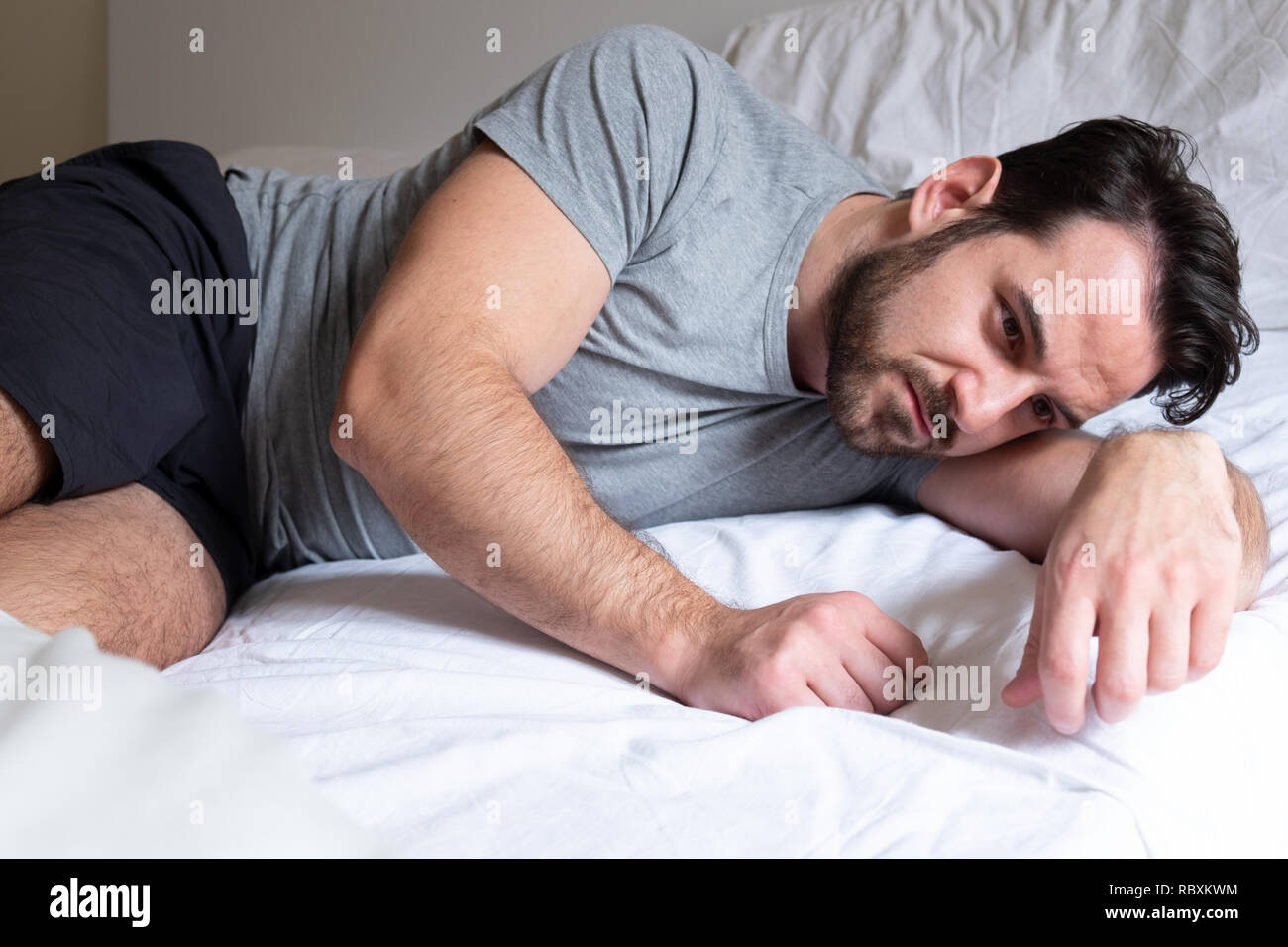 Lonely man bed hi-res stock photography and images - Alamy
