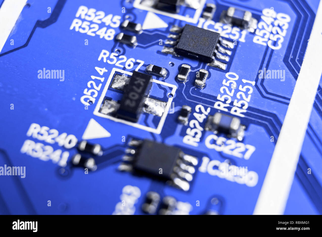 Macro shot of a Circuitboard with resistors microchips and electronic ...