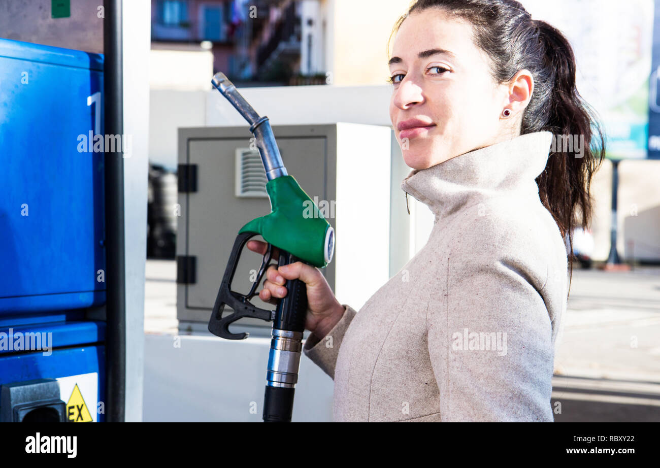 Happy girl at the gasoline station Stock Photo - Alamy