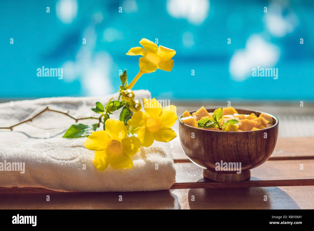 mango cubes on the background of the pool Stock Photo - Alamy