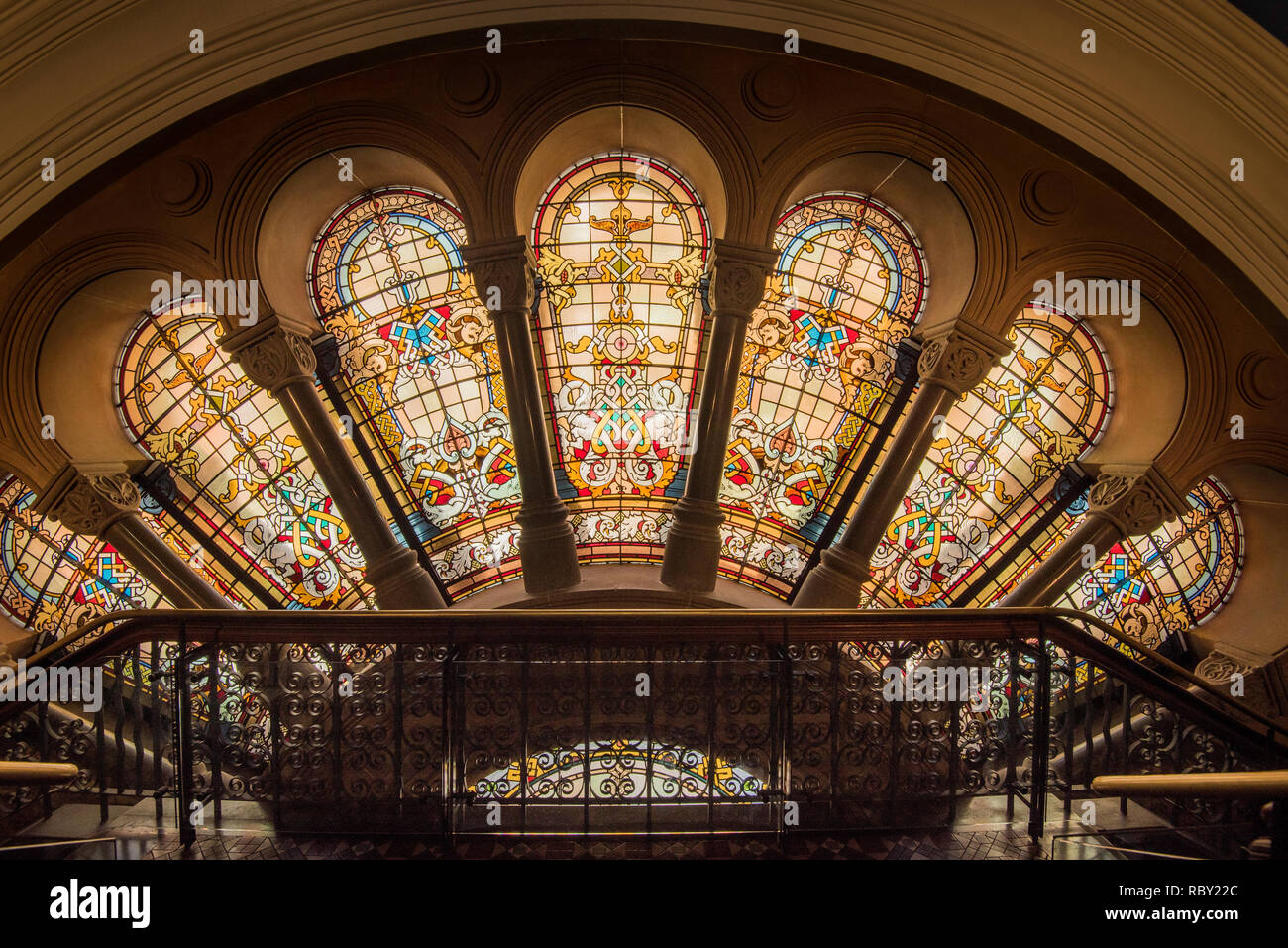 An interior view of stained glass windows on the Western side of the ...