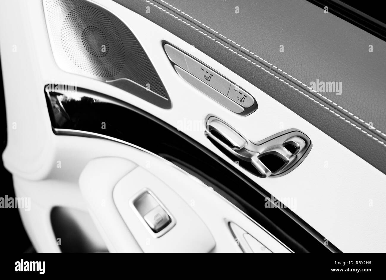 Door handle with Power seat contol buttons of a luxury passenger car ...