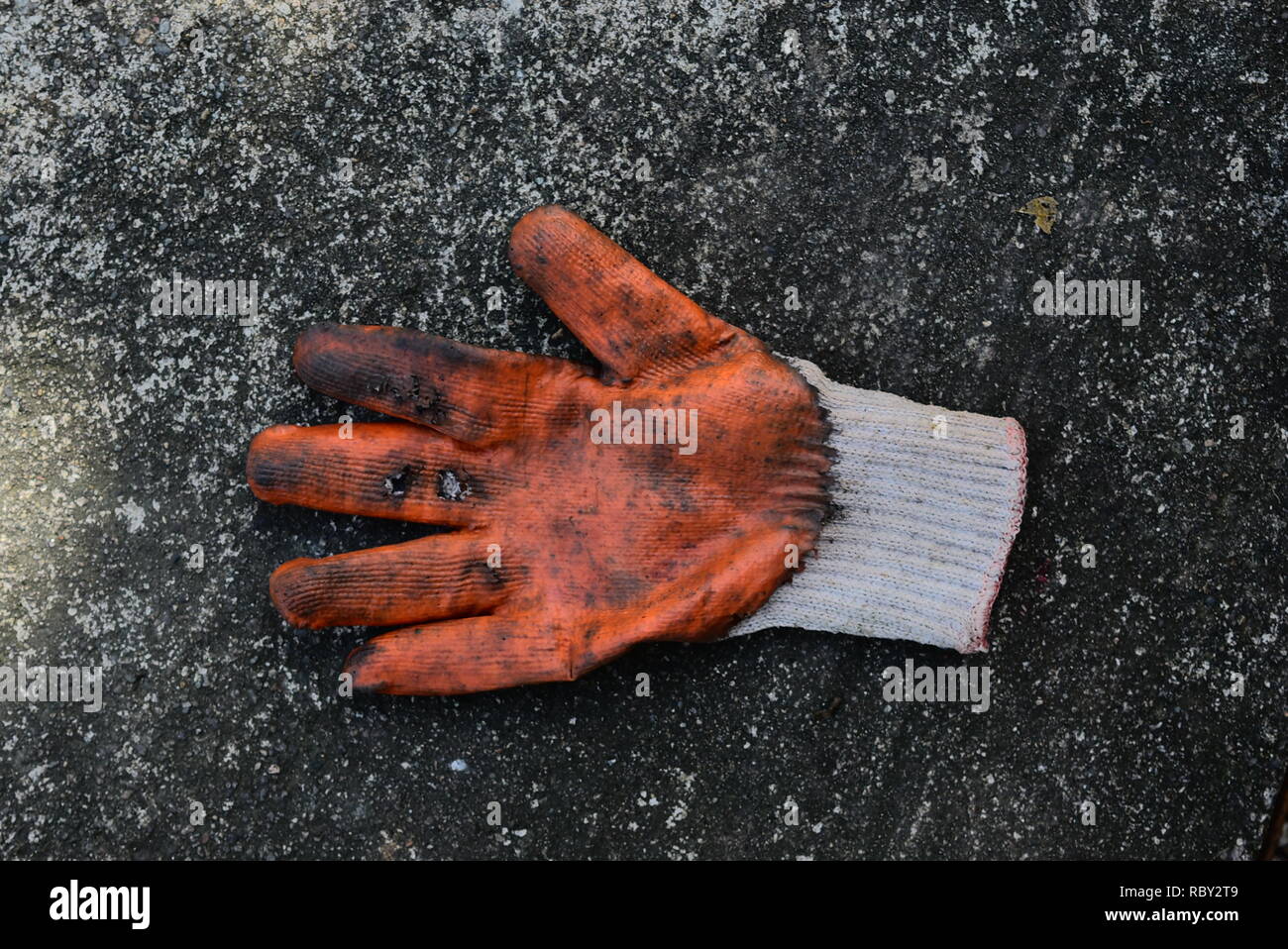 Torn gloves hi-res stock photography and images - Alamy