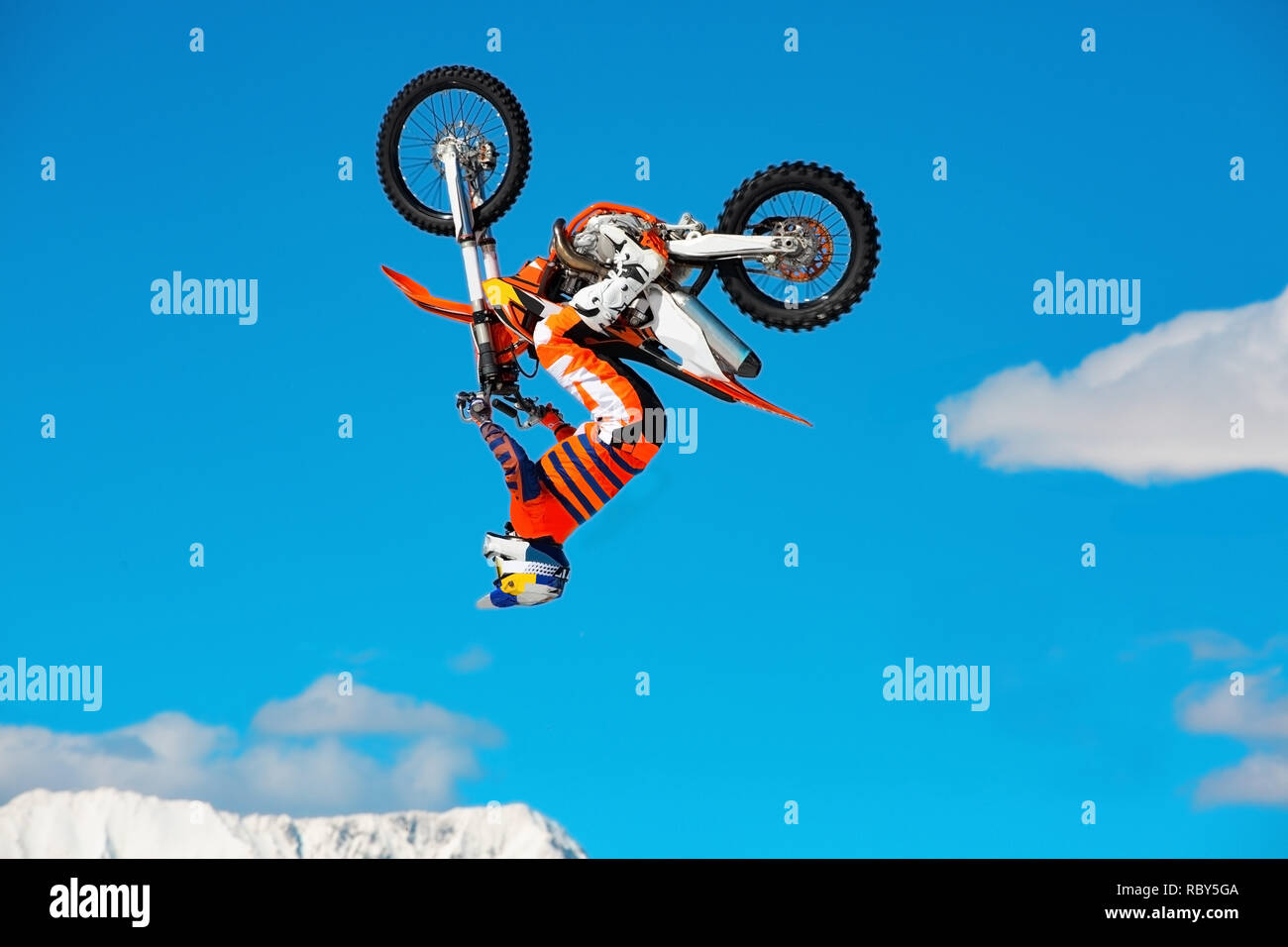 Racer on motorcycle participates in motocross cross-country in flight ...