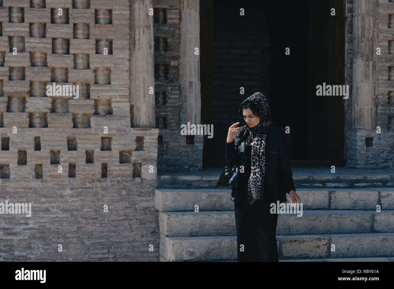 Uzbek people on the backstreets of the old town of Bukhara, Uzbekistan ...