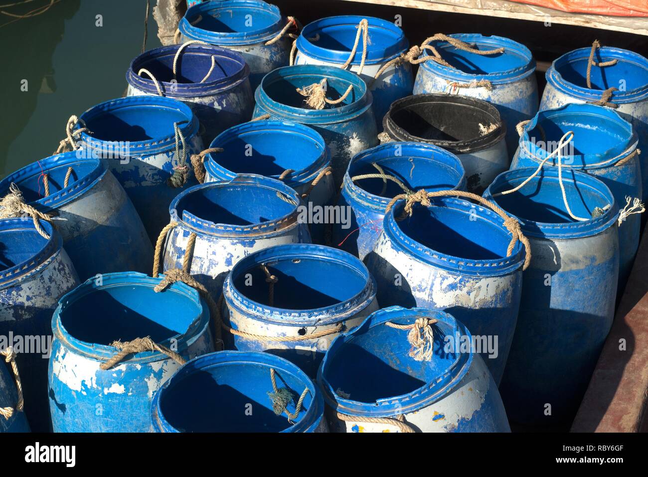 Large plastic Fish bucket Crates on a fishing boat Stock Photo - Alamy