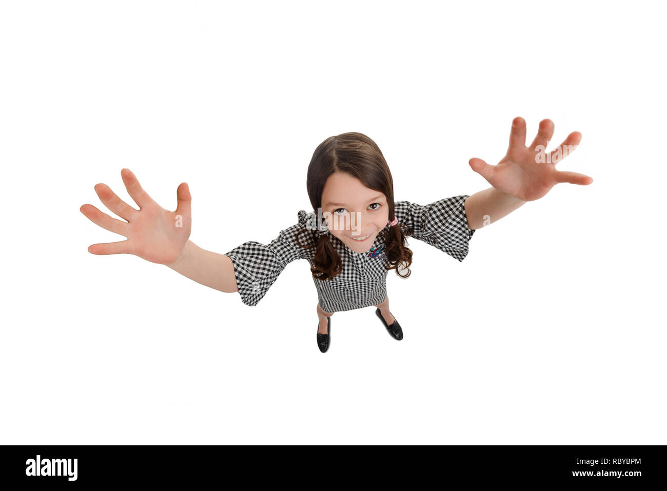 Girl showing something imaginary big Stock Photo - Alamy