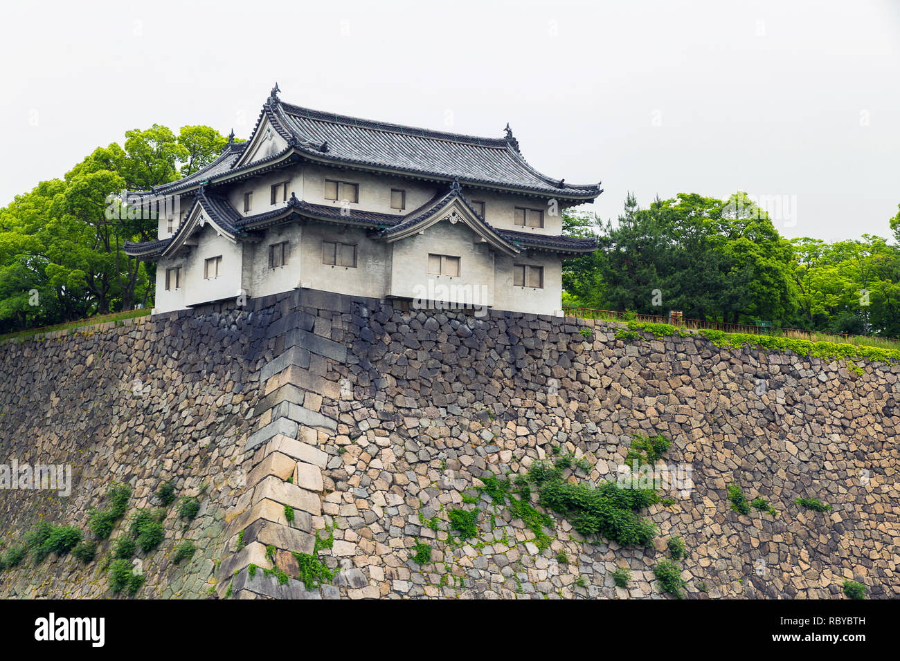 Osaka castle strong walls and japanese traditional building Stock Photo ...
