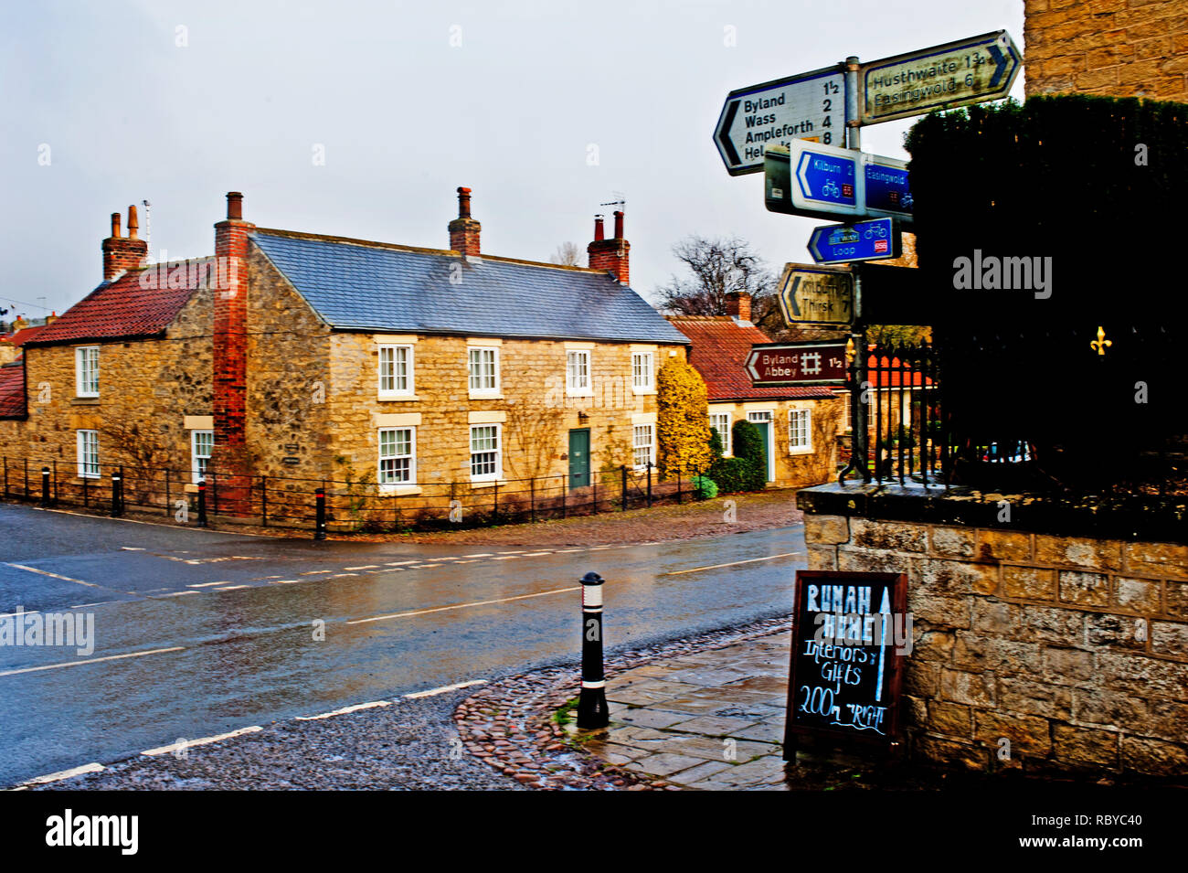 Cottages and Sign Posts, Coxwold, North Yorkshire, England Stock Photo ...