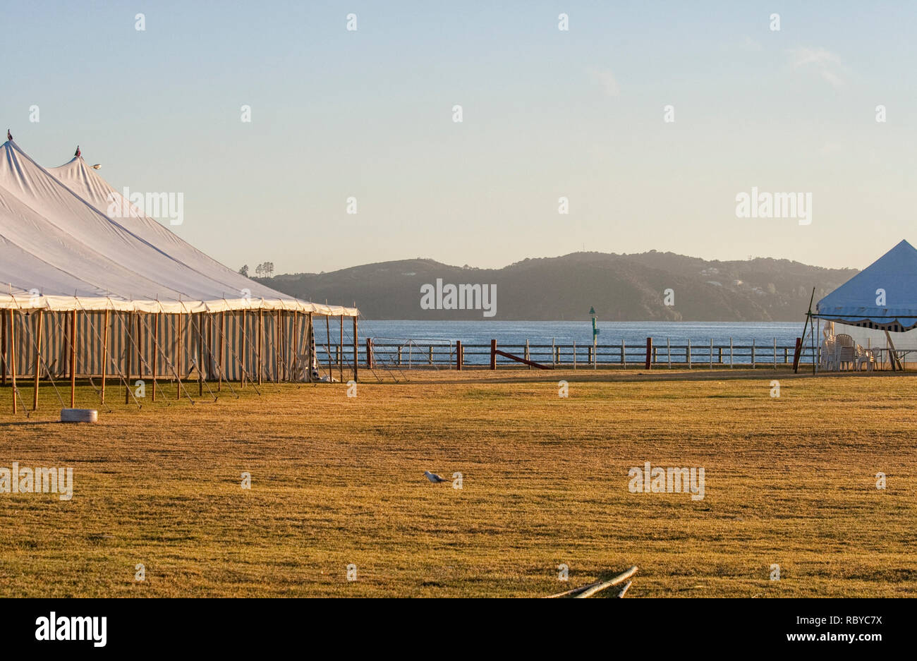A magical golden morning near the sea after a big party Stock Photo - Alamy