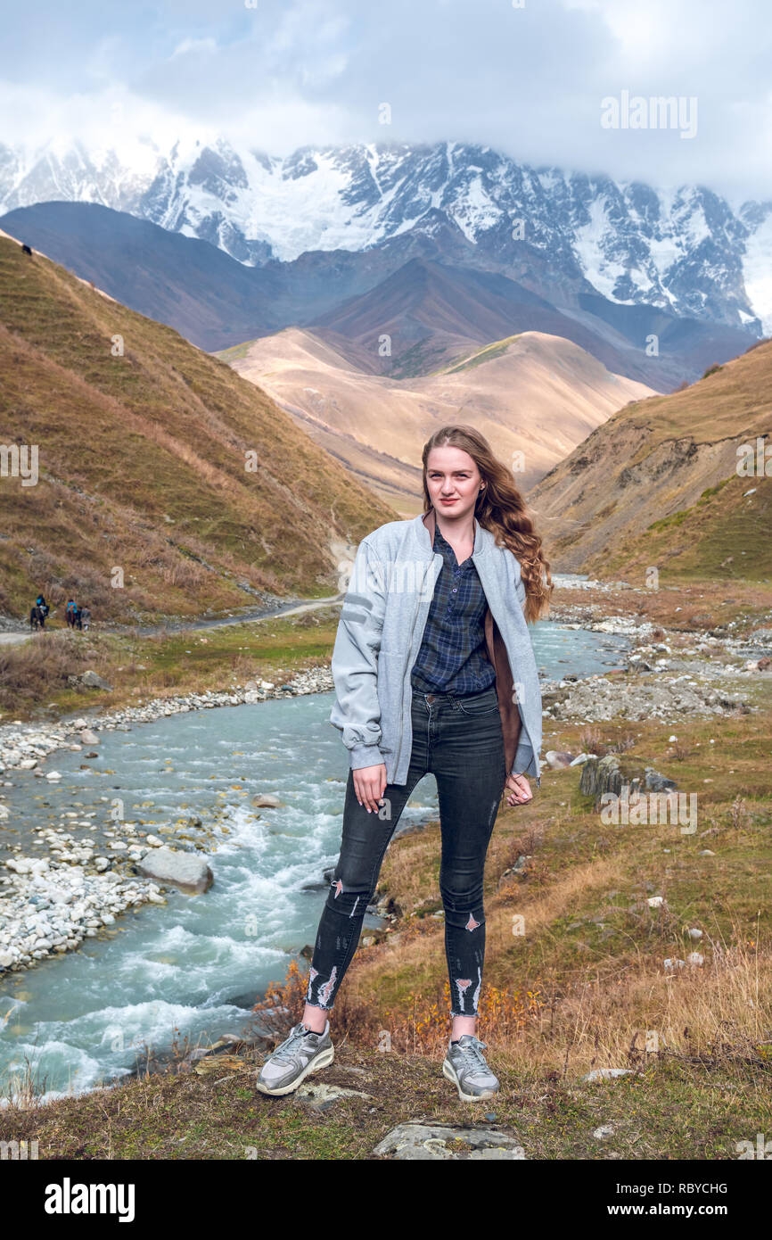 Beautiful girl on a mountain background of Svaneti, mountain Shkhara ...