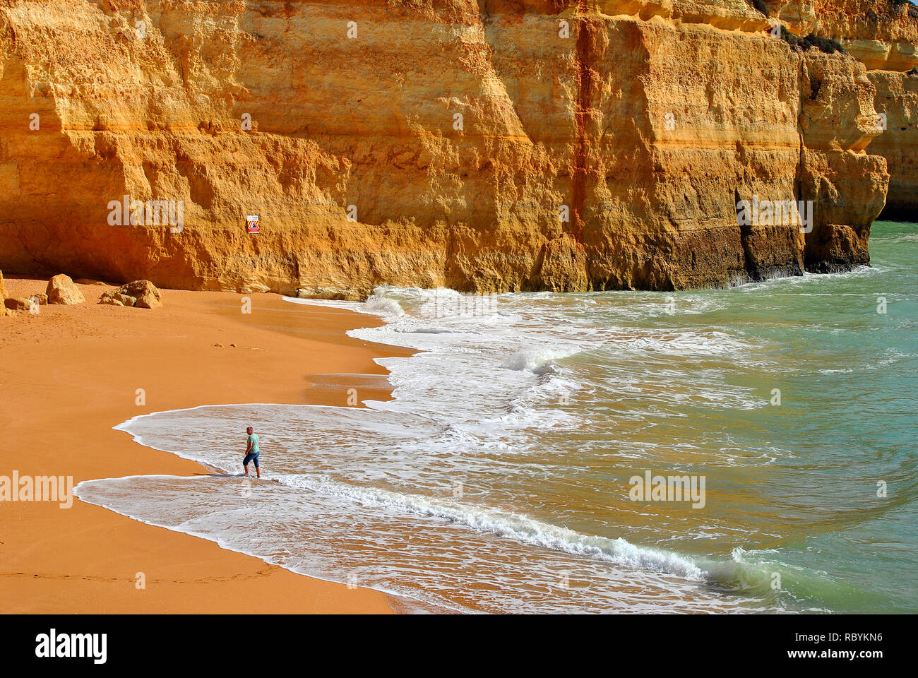 Tourist walking on Benagil Beach on the Algarve coast Stock Photo - Alamy