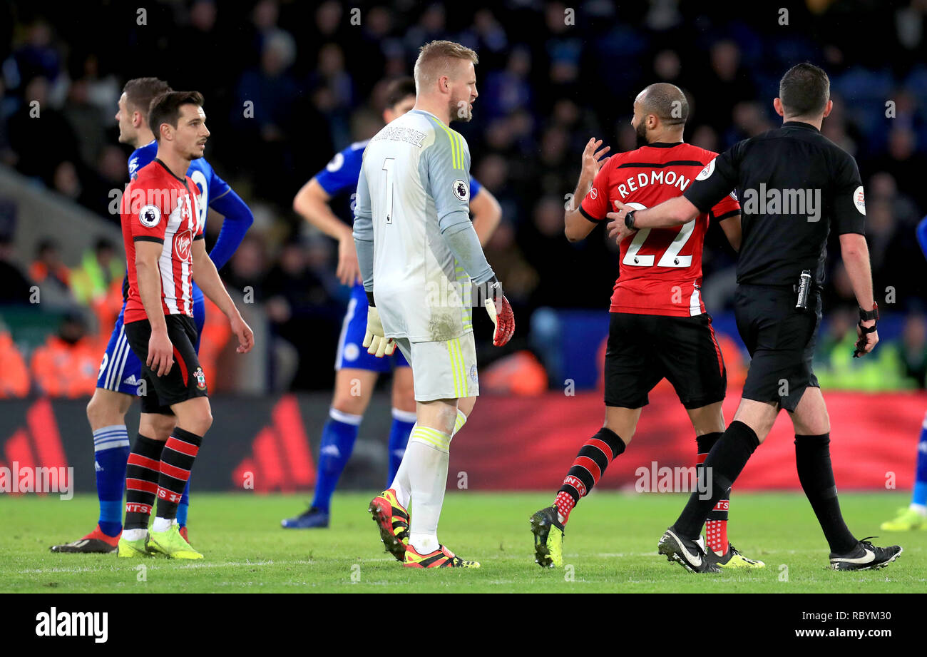 Leicester City goalkeeper Kasper Schmeichel (centre) has words with ...