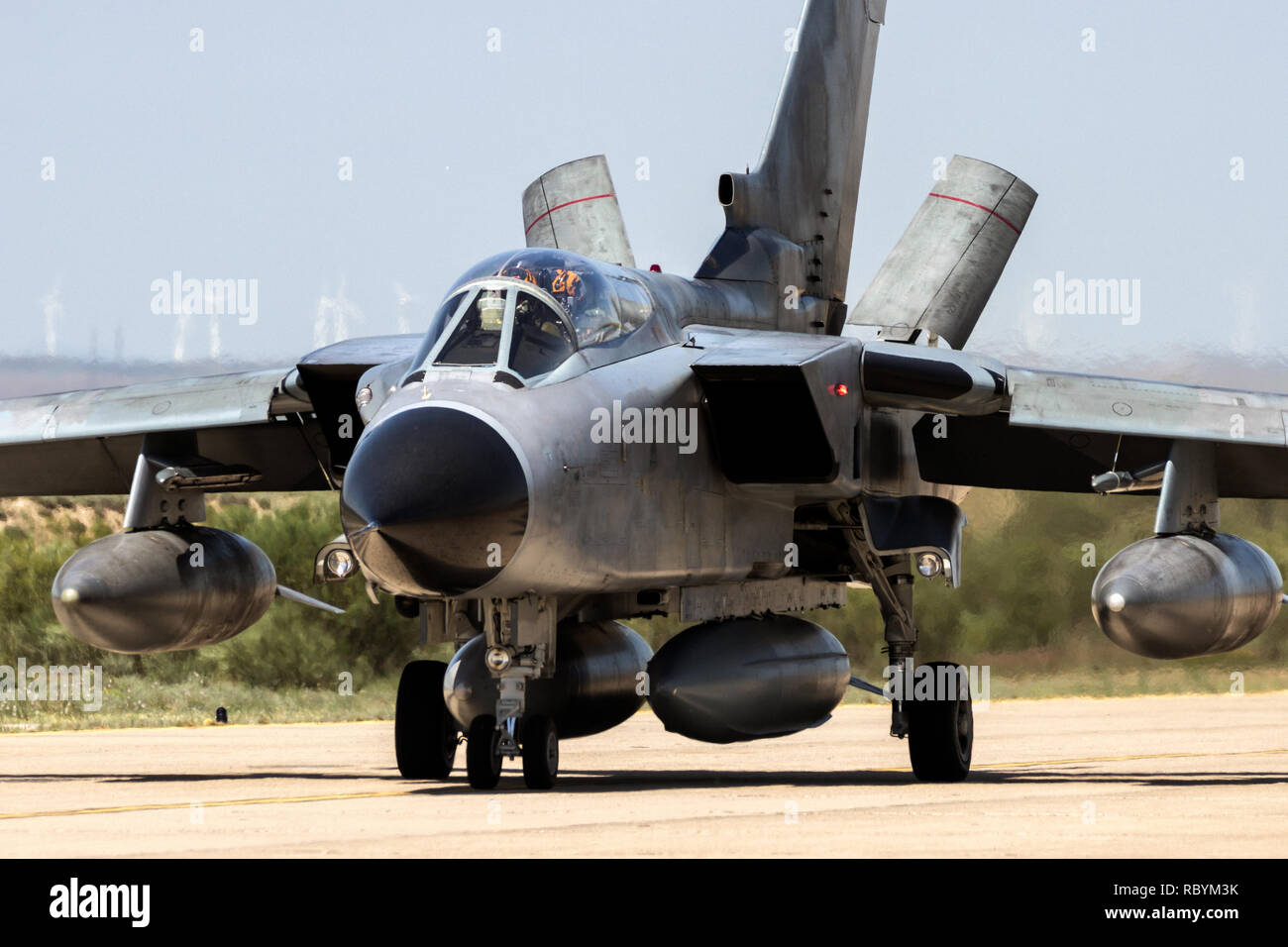 Front view of a military bomber fighter jet aircraft taxiing on an ...