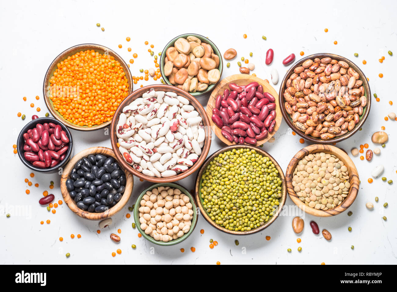 Legumes, lentils, chikpea and beans assortment in different bowls on ...