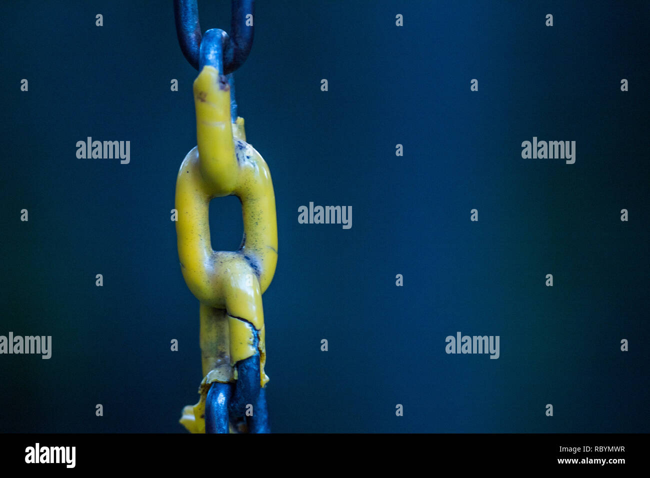 An artistic photo of a plastic coated steel chain Stock Photo - Alamy