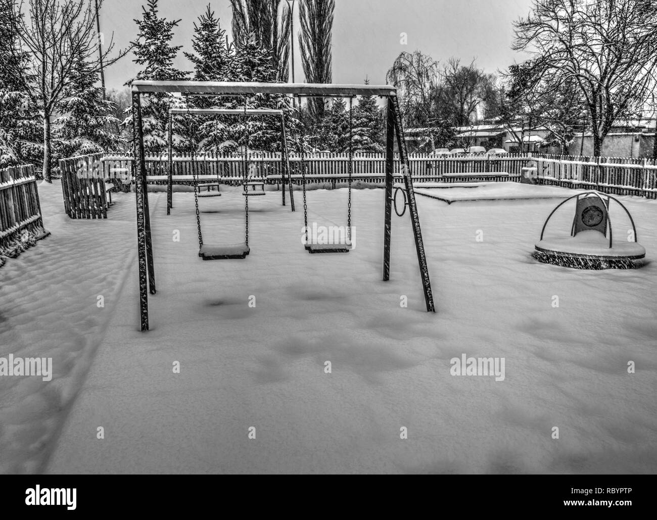 Winter playground in black and white Stock Photo - Alamy
