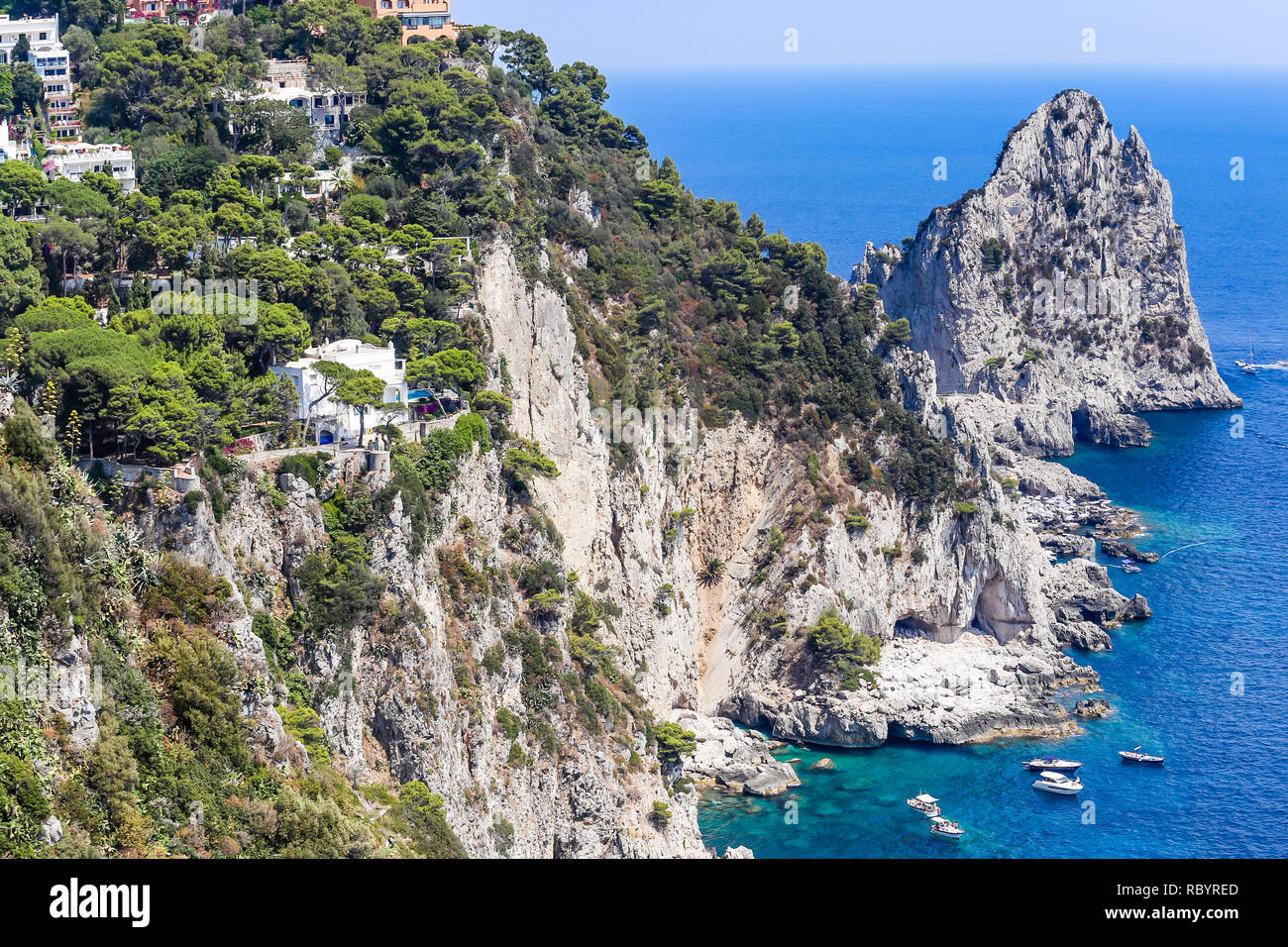 Italy. Capri Island. Faraglioni rock formation and town Capri seen from ...
