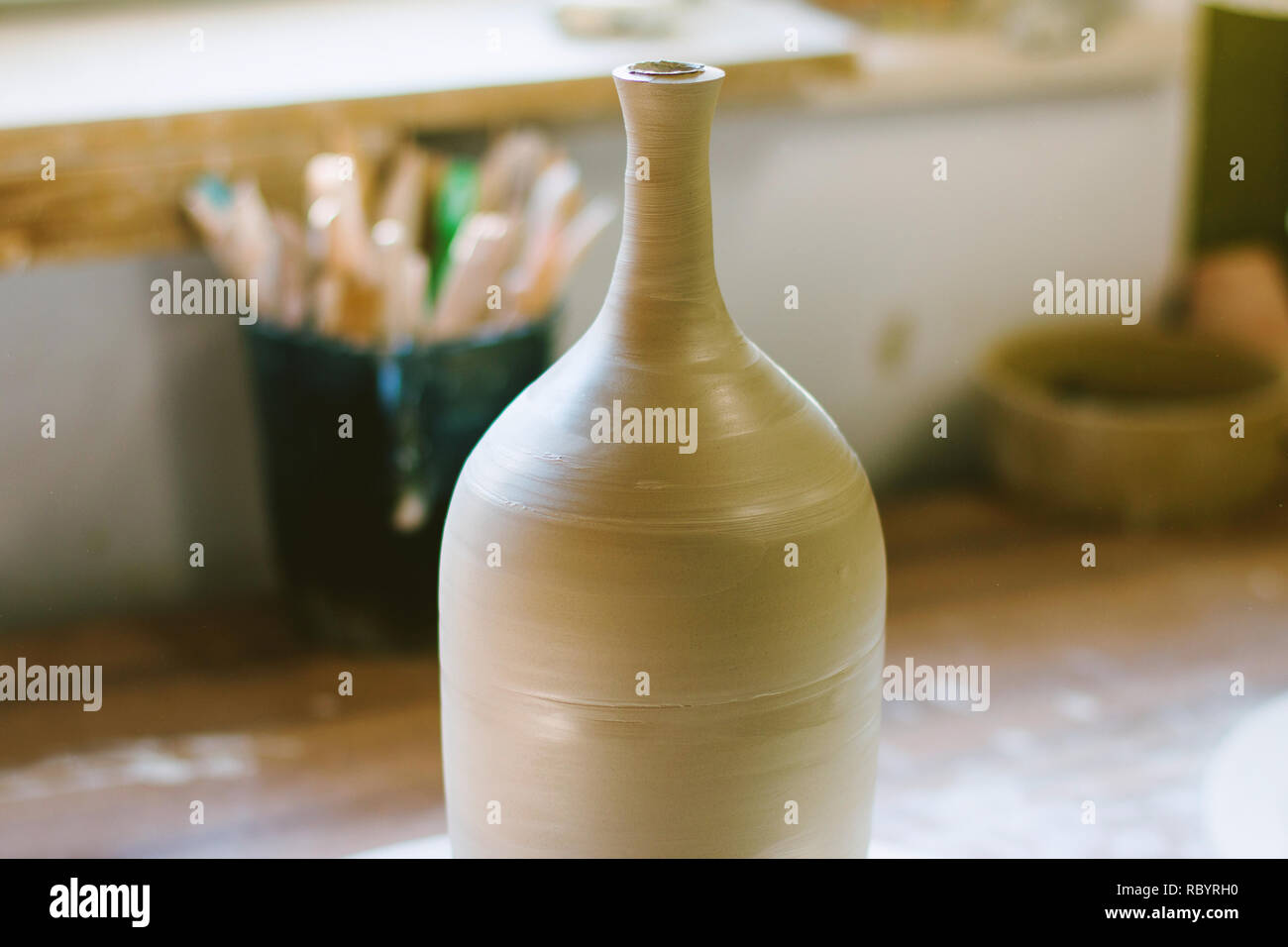 Clay pottery drying in the workshop, small artistic craft business ...
