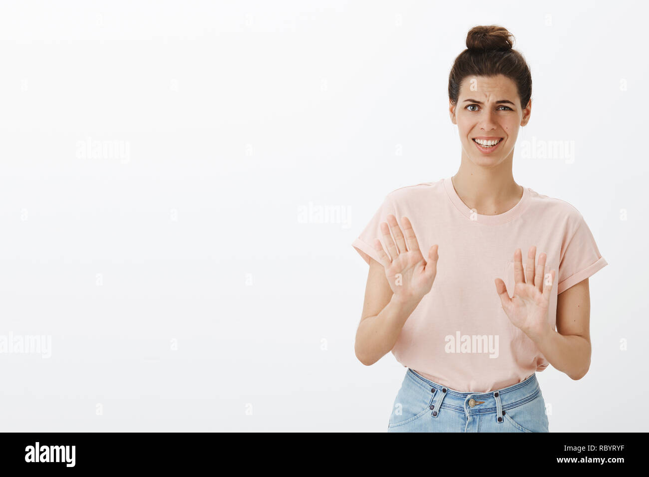 Bothered polite young female coworker rejecting creepy and disgusting ...