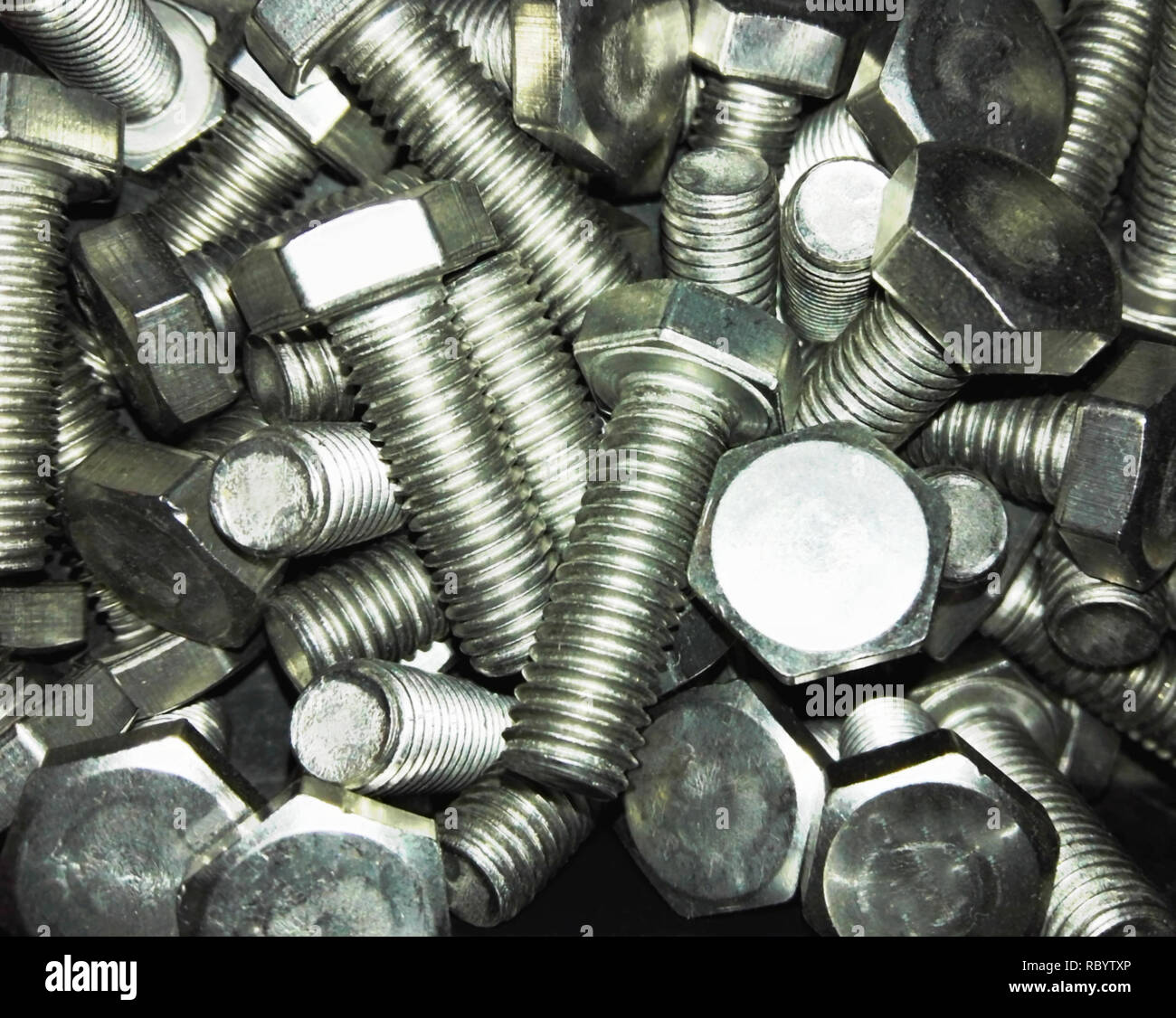 Pile of big steel screws for metal connection and construction, close ...