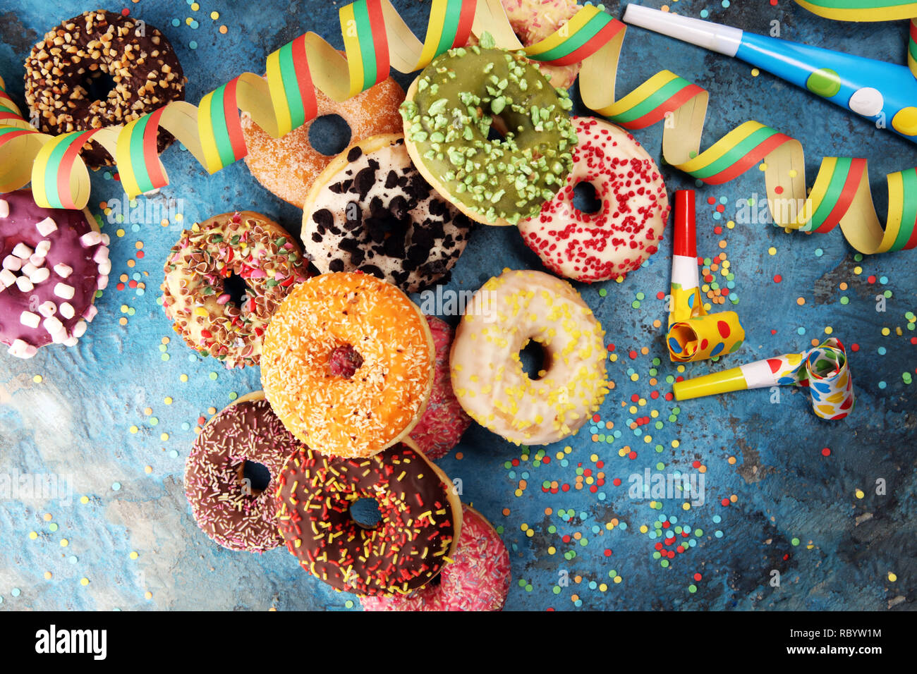 assorted donuts with chocolate frosted, pink glazed and sprinkles ...
