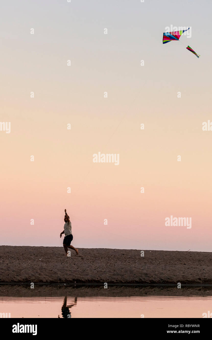 Flying kite sunset hi-res stock photography and images - Alamy