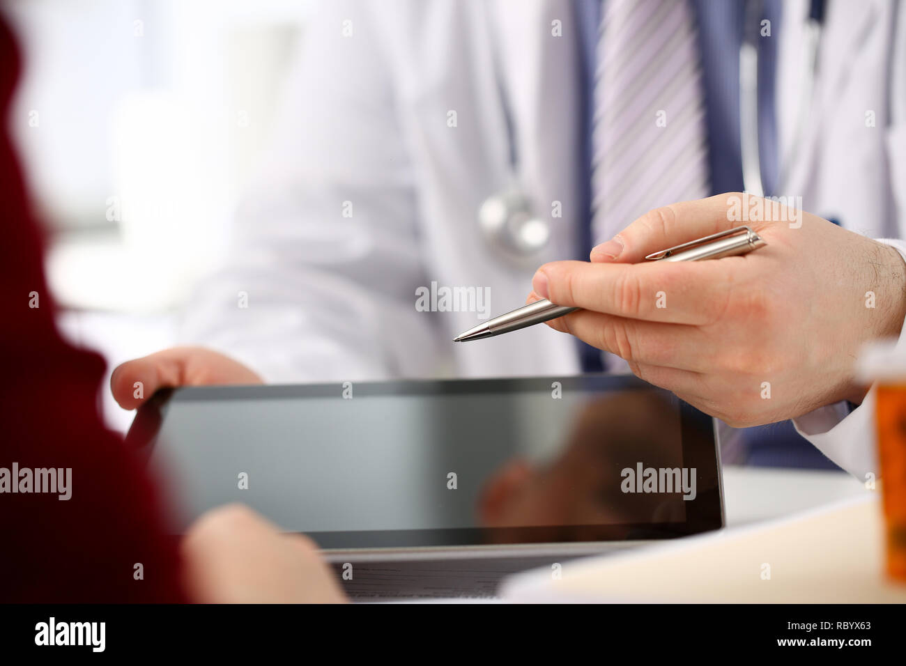 Female doctor hands hold and show digital Stock Photo - Alamy