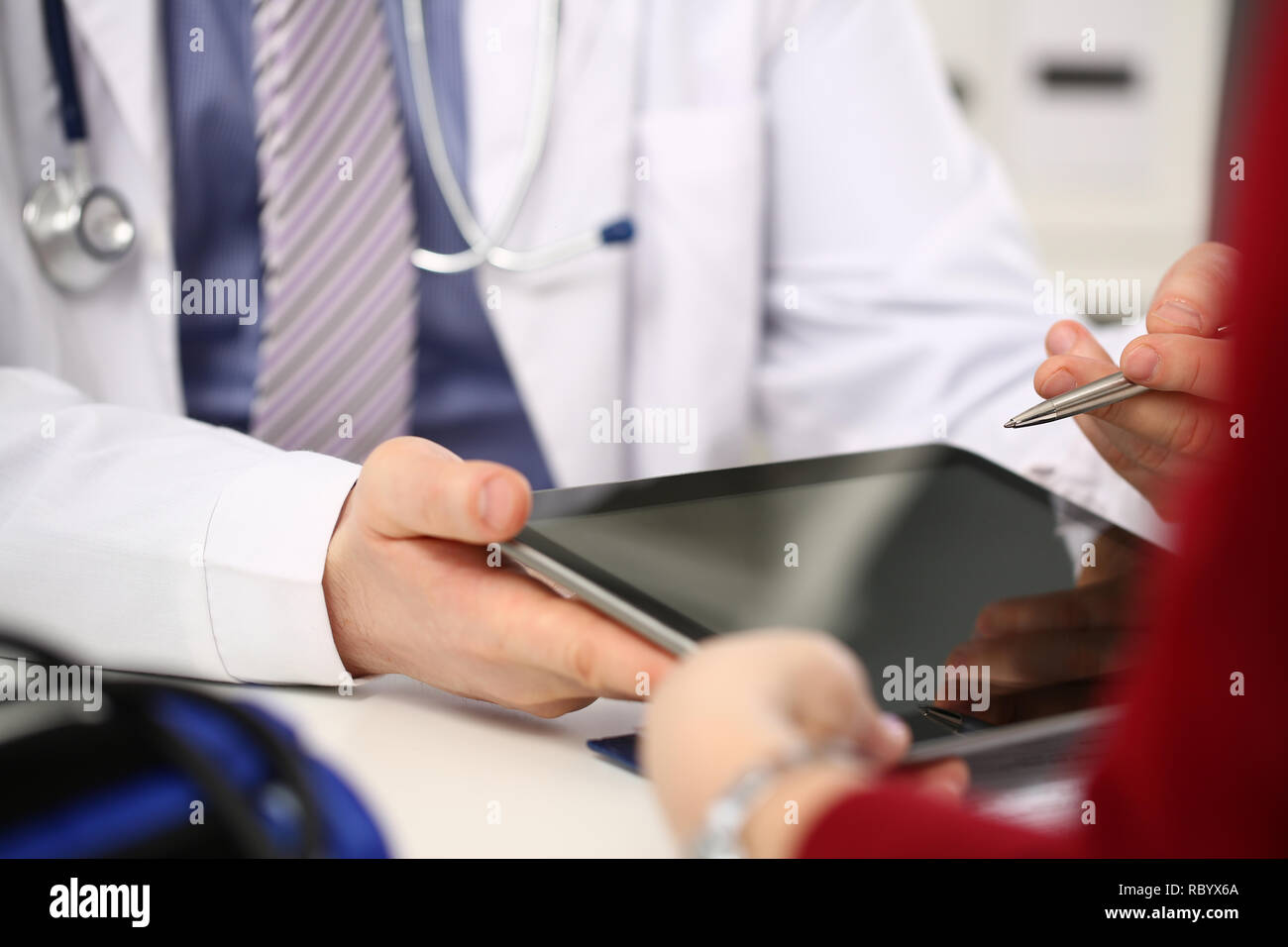 Female doctor hands hold and show digital Stock Photo - Alamy