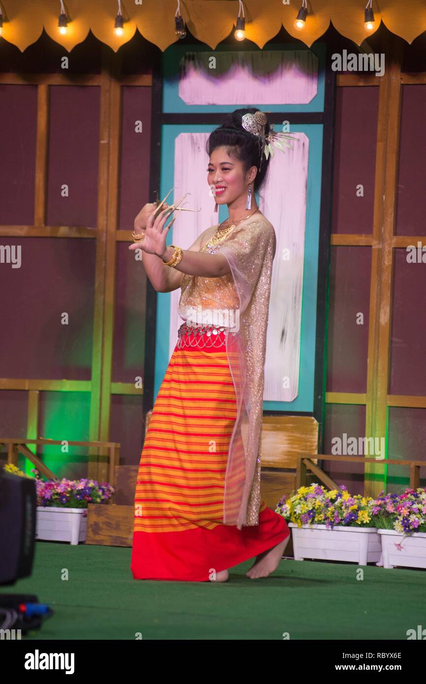 The pretty lady in Middle Thai classical dancing suit is showing ...