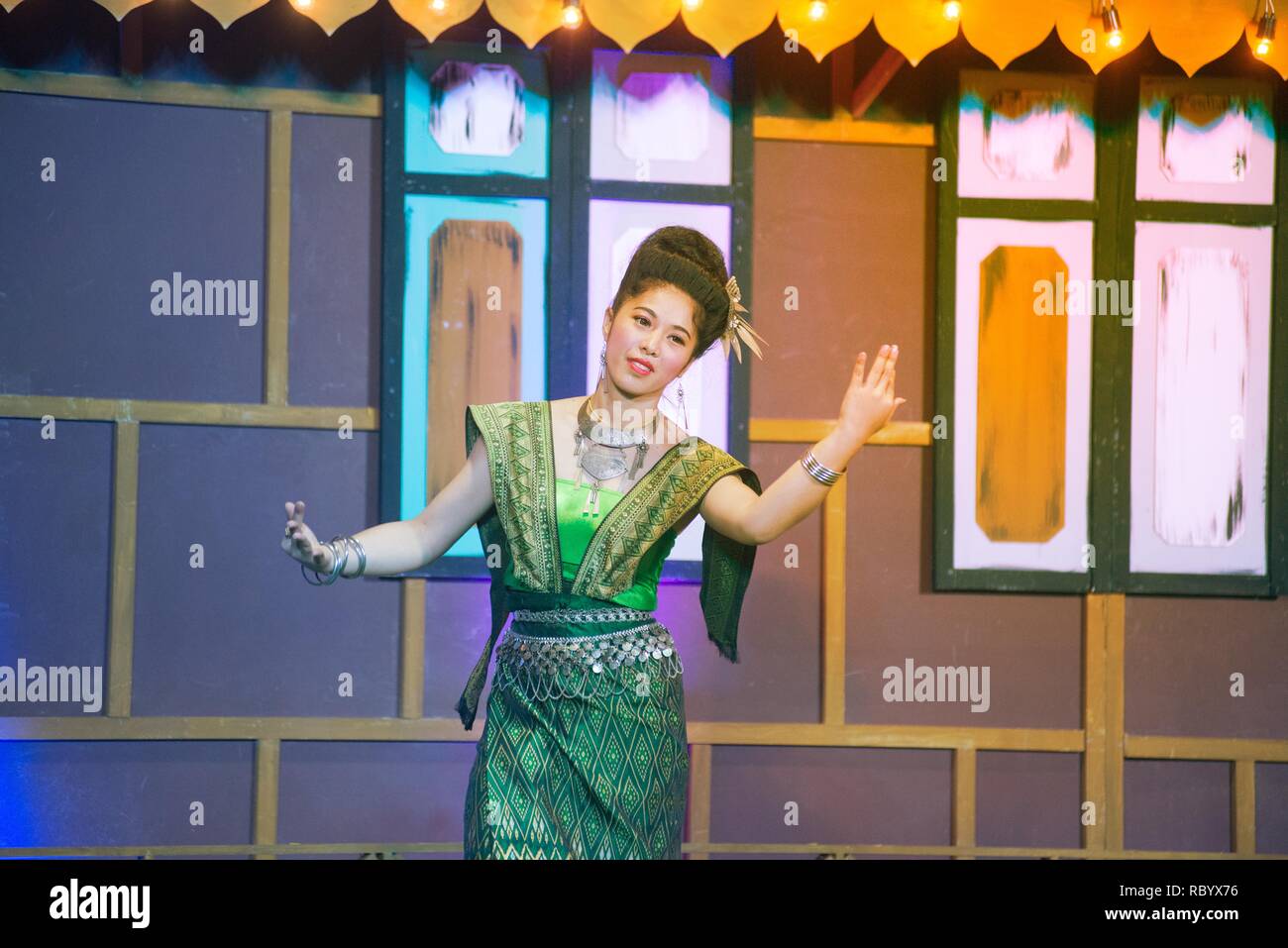 The pretty lady in Middle Thai classical dancing suit is showing ...