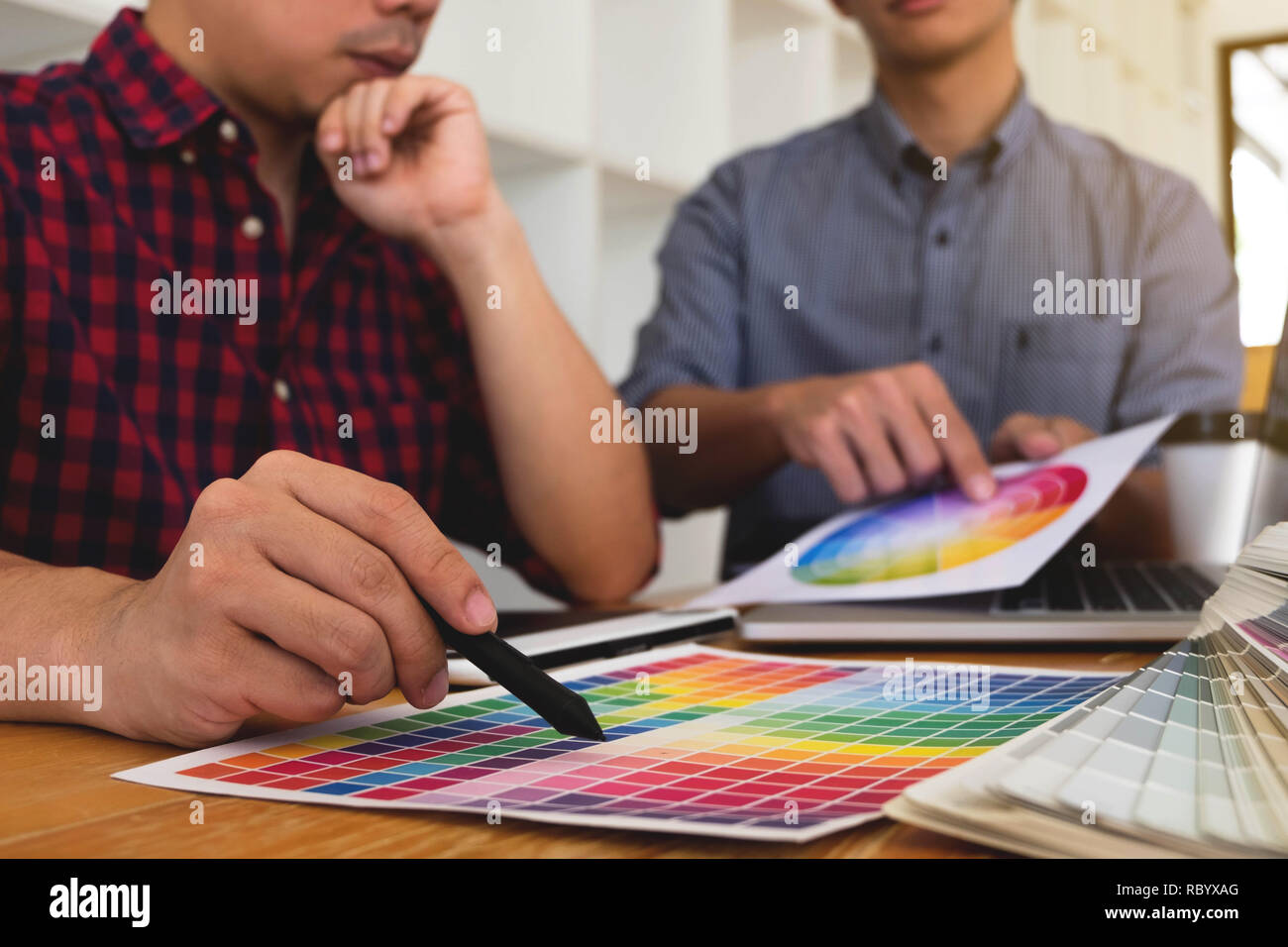 Graphic designers choose colors from the color bands samples for design ...