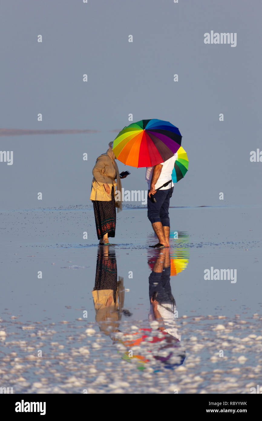 A family on the salt flat of Urmia Lake, West Azerbaijan province, Iran ...