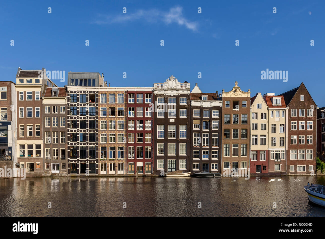 Tall Dutch houses, overlooking a canal in Amsterdam. These houses are ...