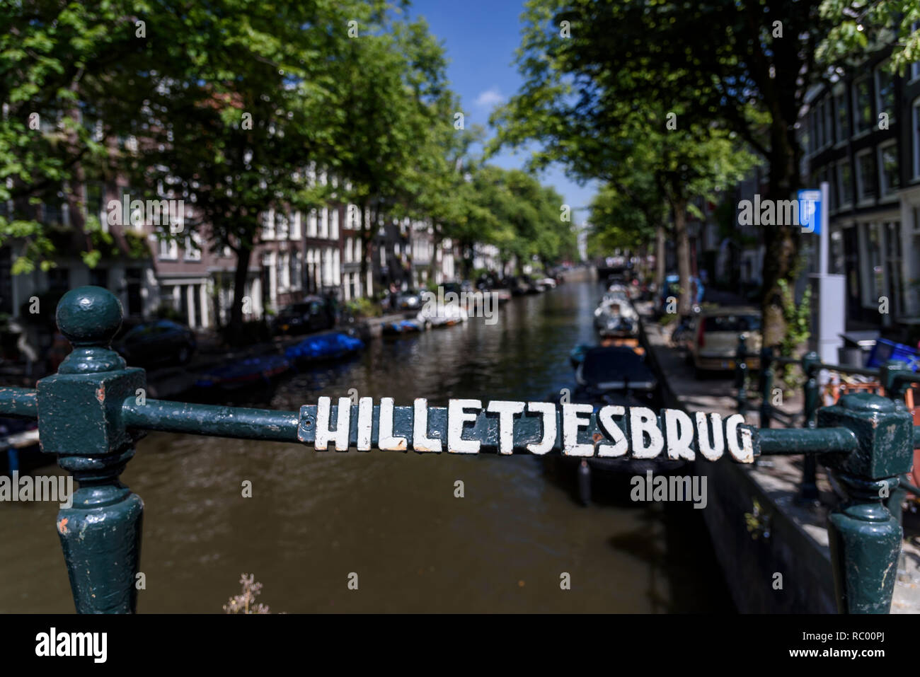 traditional street sign in the Dutch capital of Amsterdam. The names of ...